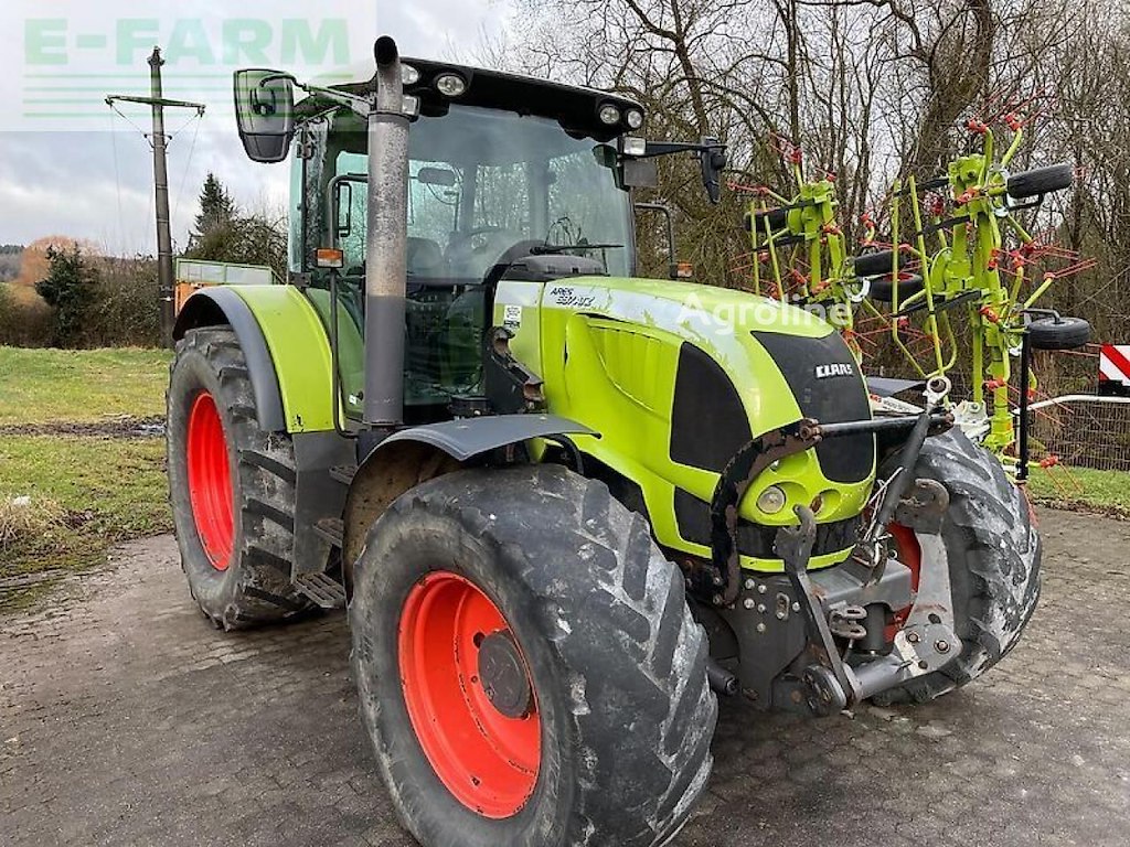 Claas ares 697 atz mit fronthydraulik und frontladerkonsolen stoll ATZ traktor točkaš