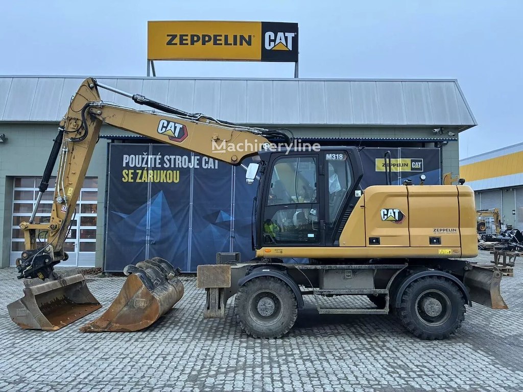 Caterpillar M318 bager točkaš
