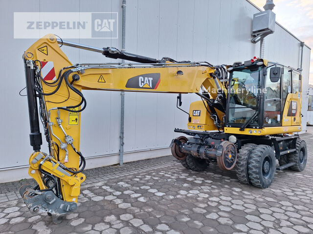 Caterpillar M323F bager na šinama