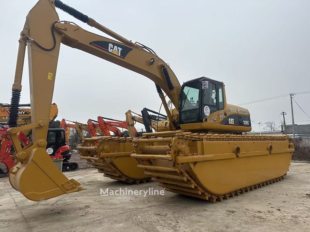 Caterpillar 320CL bager amfibija