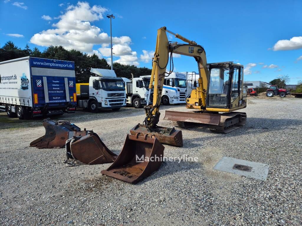 Caterpillar 307 with extra buckets midi bager