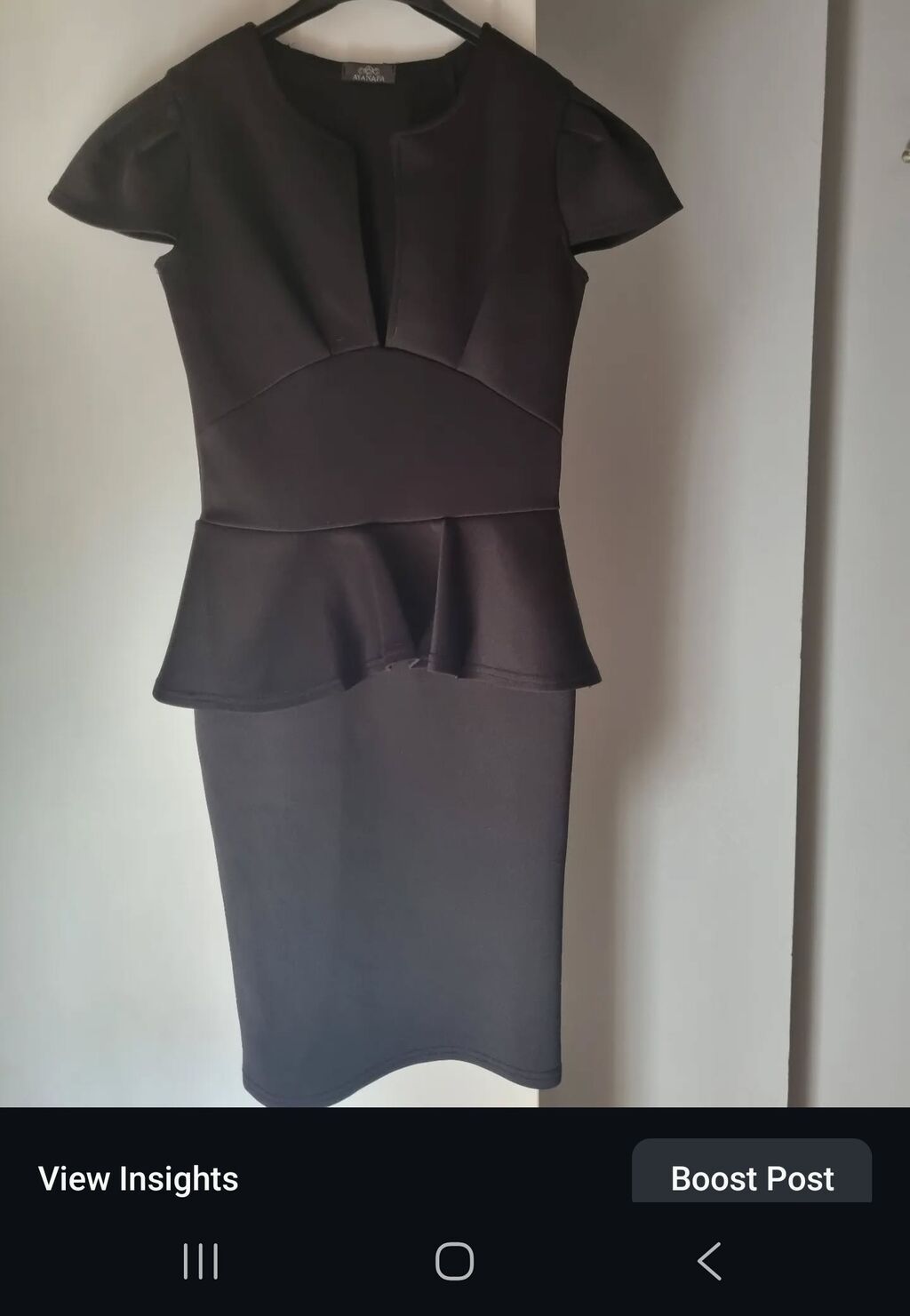 Elegantna crna haljina sa peplum detaljem u struku. M VEL. Nosena