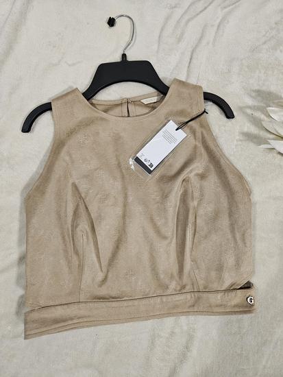 Nov Guess logo top L