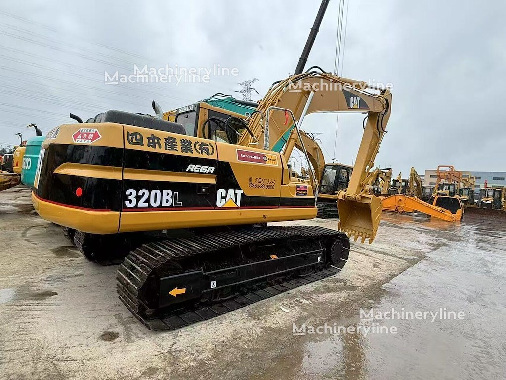 Caterpillar 320BL bager guseničar