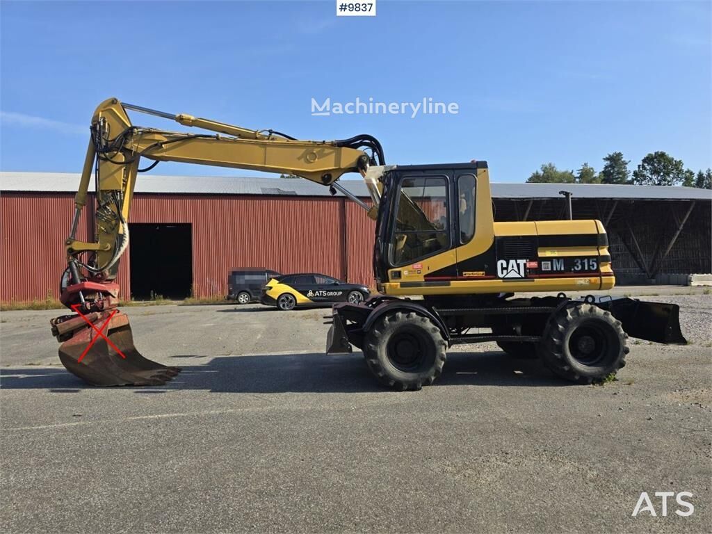 Caterpillar M315 wheel excavator with Hydraulic S60 bucket att bager točkaš
