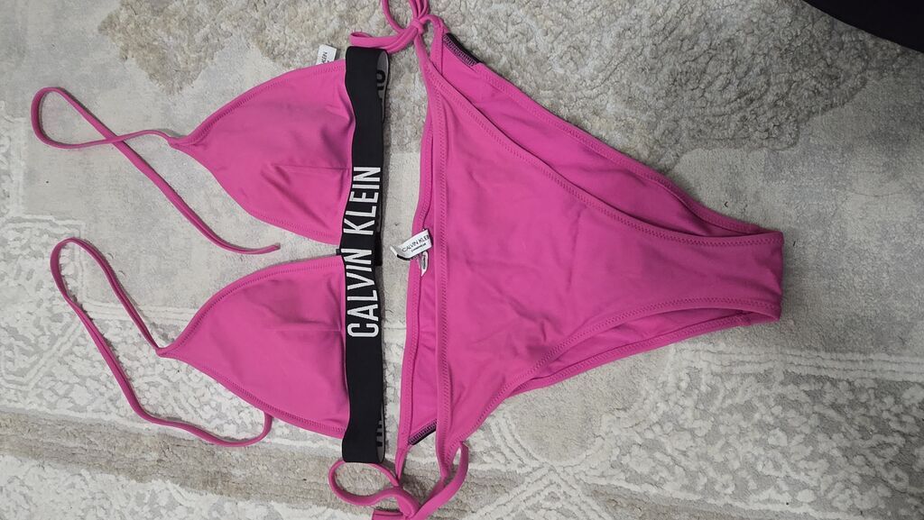 Ženski dvodelni kupaći kostim Calvin Klein original u roze boji. -
