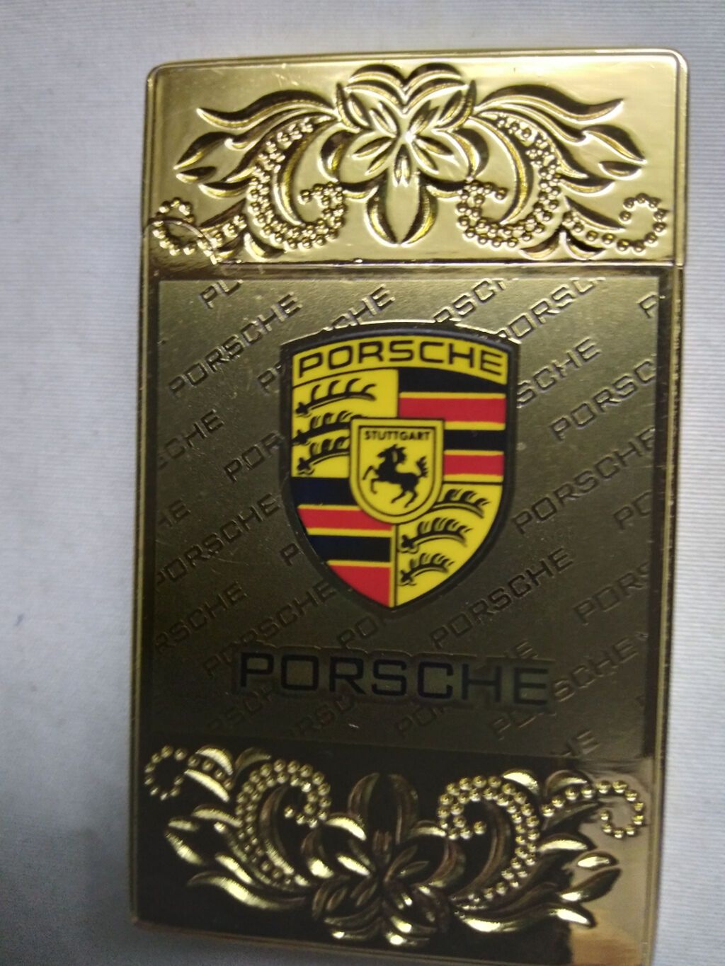 Porsche upaljac 6,2 cm.Nekorišćen,kao nov