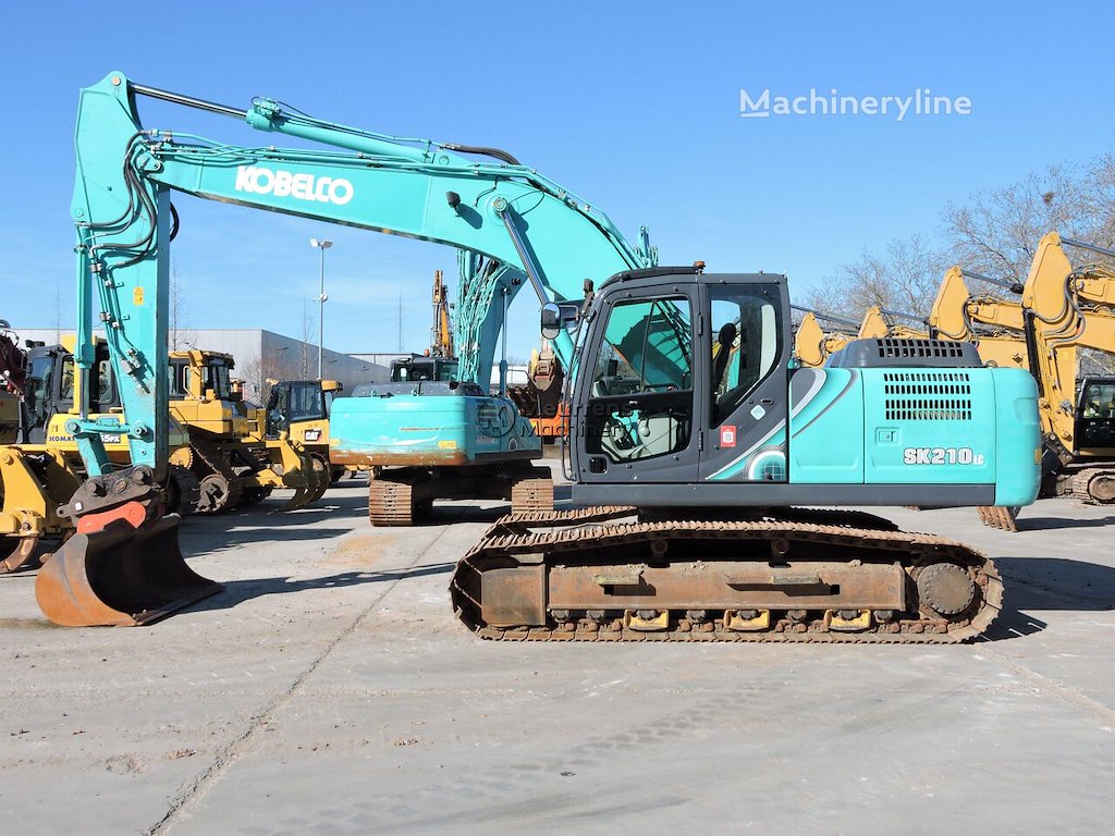 Kobelco SK210 bager guseničar