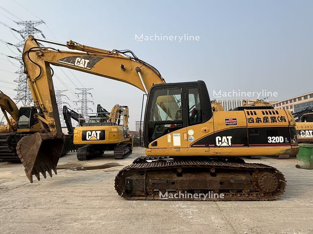 Caterpillar 320DL bager guseničar