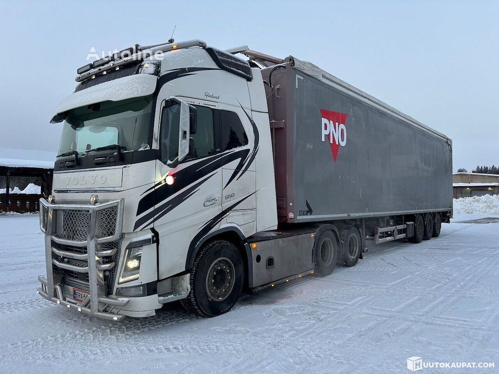 Prodaje se Volvo FH 650 tegljač na aukciji + poluprikolica sa pokretnim podom