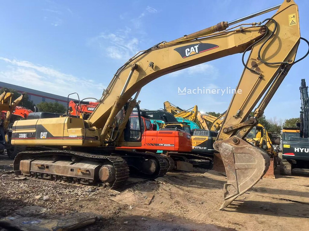 Caterpillar 330BL bager guseničar