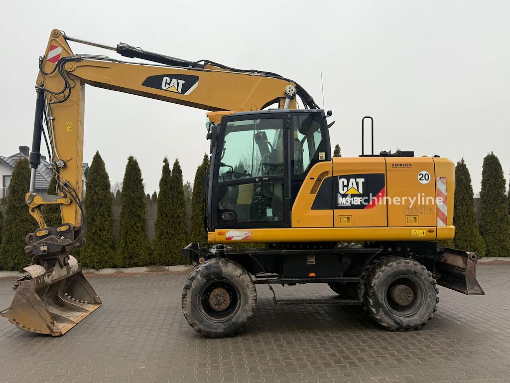 Caterpillar M318 bager točkaš