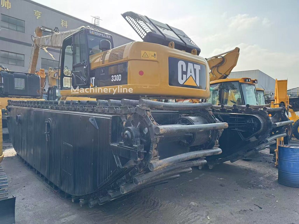 Caterpillar 330D bager amfibija
