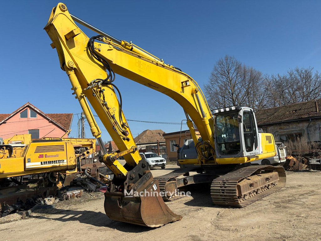New Holland E265 bager guseničar