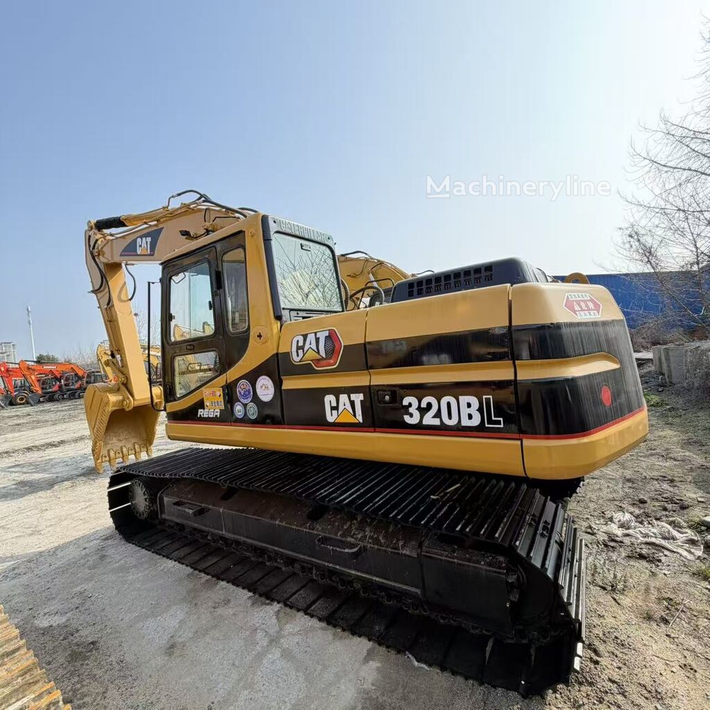 Caterpillar 320bl with wide track bager guseničar