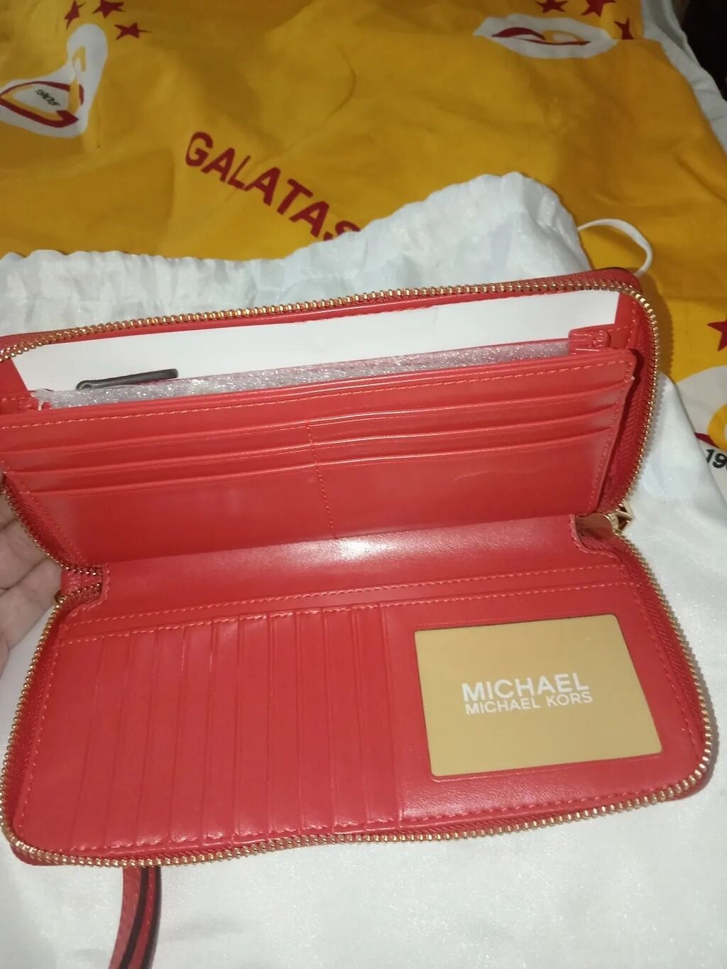Michael Kors ženski kožni novčanik/ručna torbica (wristlet), crvene