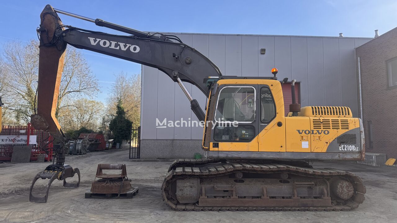Volvo EC210BL with grab and magnet bager guseničar