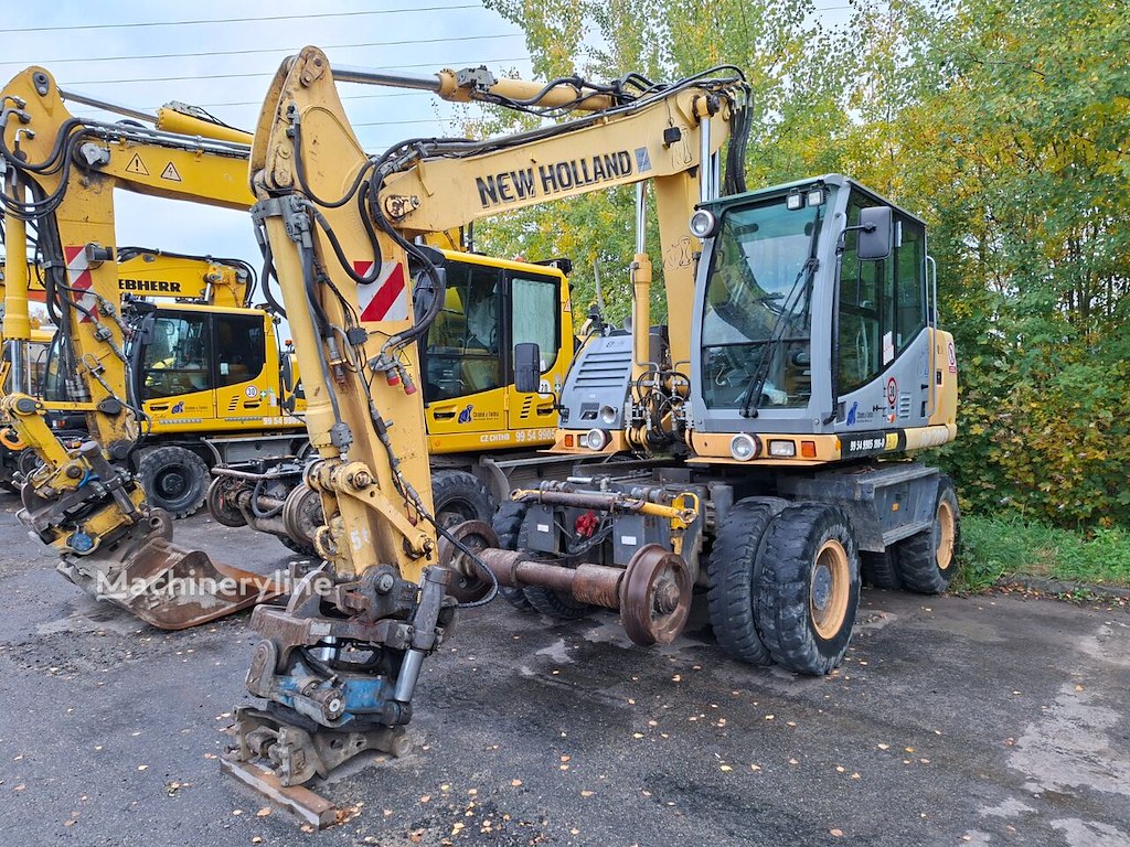 Prodaje se New Holland MH PLUS 4X4 bager na šinama na aukciji