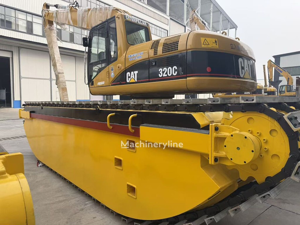 Caterpillar 320CL bager amfibija