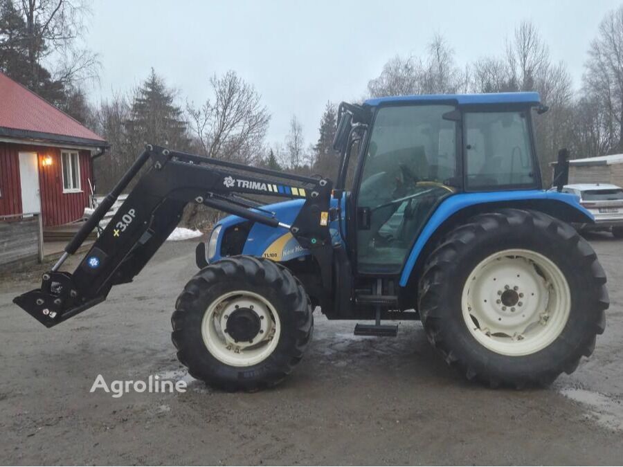 Prodaje se New Holland TL100A traktor MVA FRI 4500 timer Frontlaster traktor točkaš na aukciji