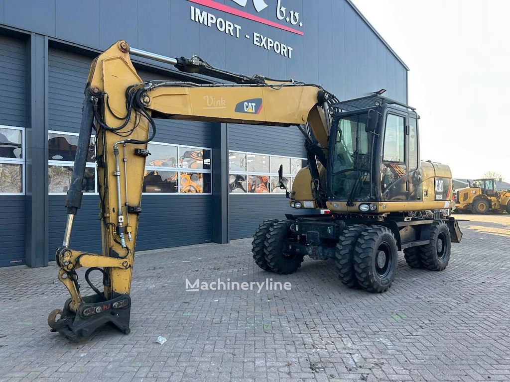 Caterpillar M315D bager točkaš