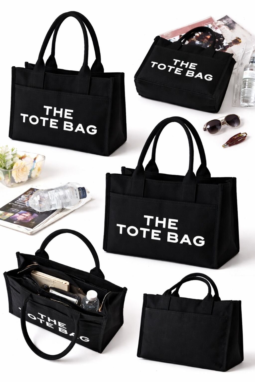 Crna platnena tote torba sa belim natpisom “THE TOTE BAG”. -