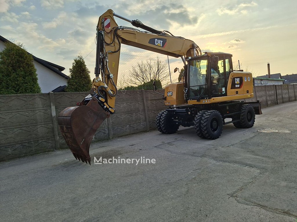 Caterpillar M318 bager točkaš