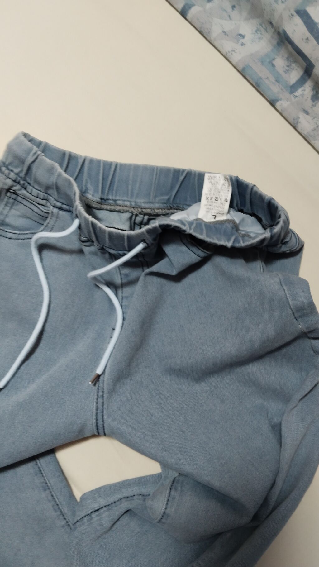 Laganije muške/ženske pantalone od svetlog denima (jogger stil) -