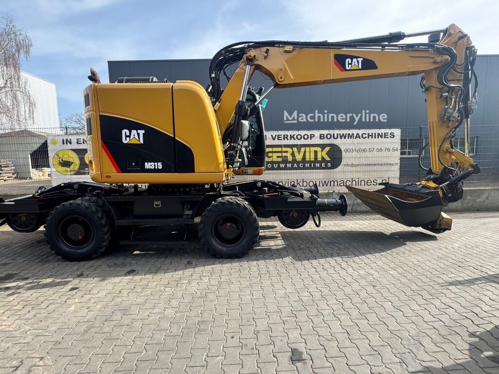 Caterpillar 315 bager na šinama
