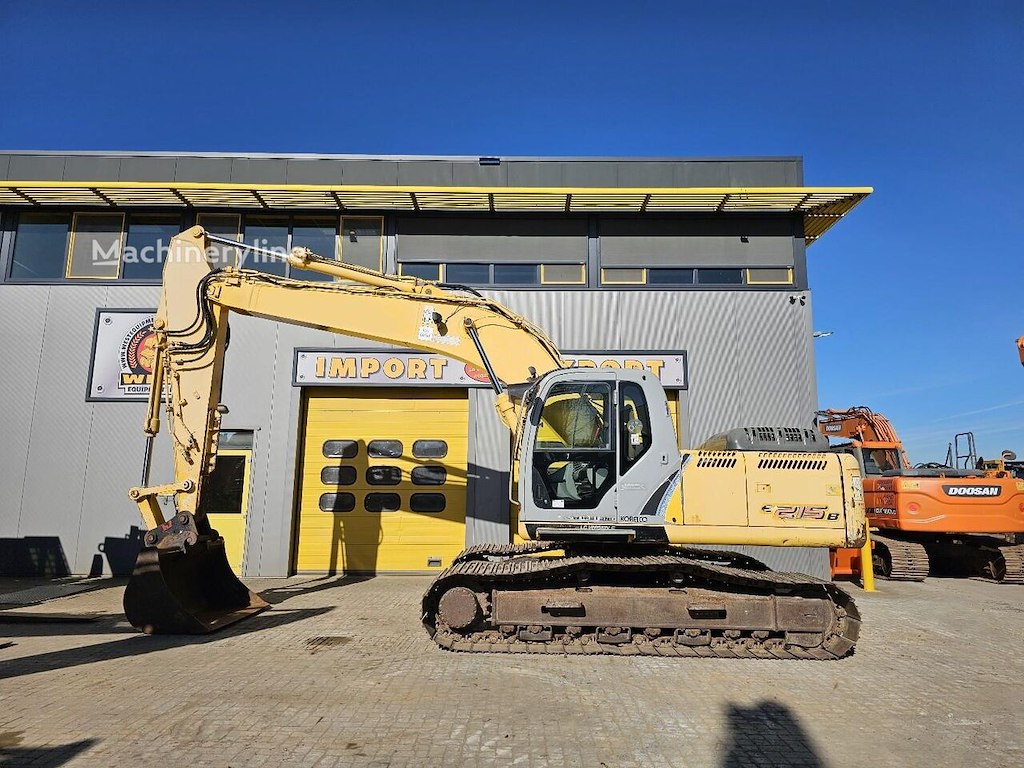 New Holland Kobelco E215 bager guseničar