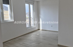 NAJLUKSUZNIJA ZGRADA U RUMI. USELJIV. DVOSOBAN. 52m2