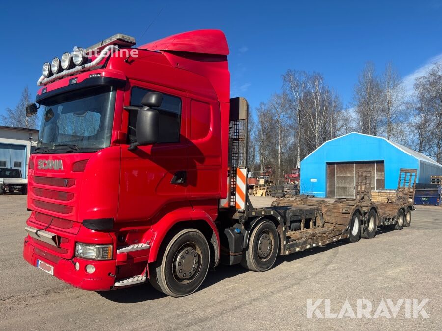 Prodaje se Scania R490 tegljač na aukciji + poluprikolica sa niskom platformom