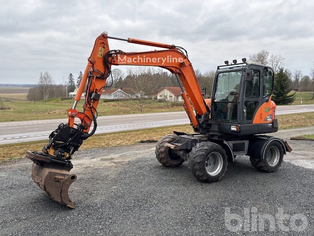 Prodaje se Doosan DX55WK bager točkaš na aukciji