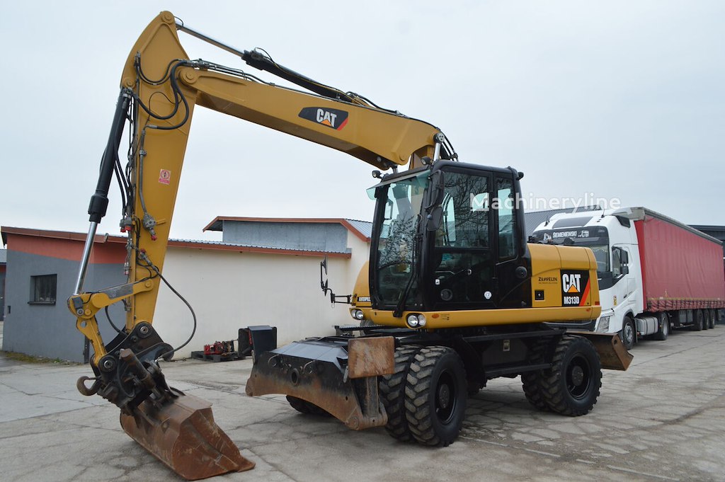 Caterpillar 313 bager točkaš