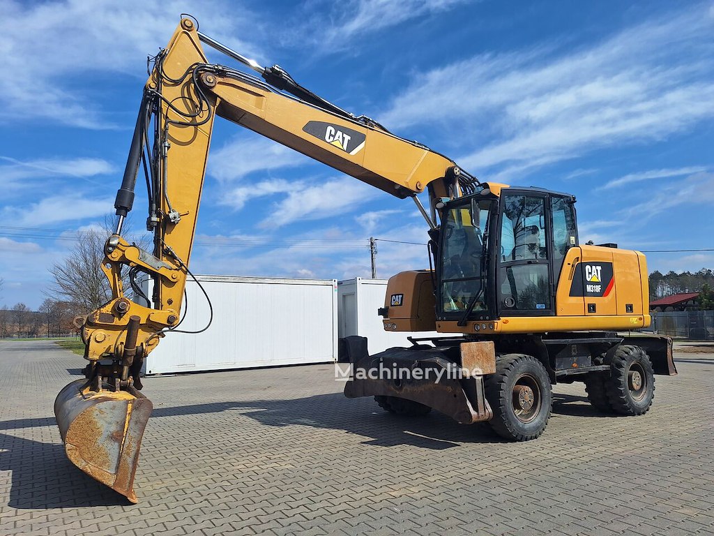 Caterpillar M318 bager točkaš