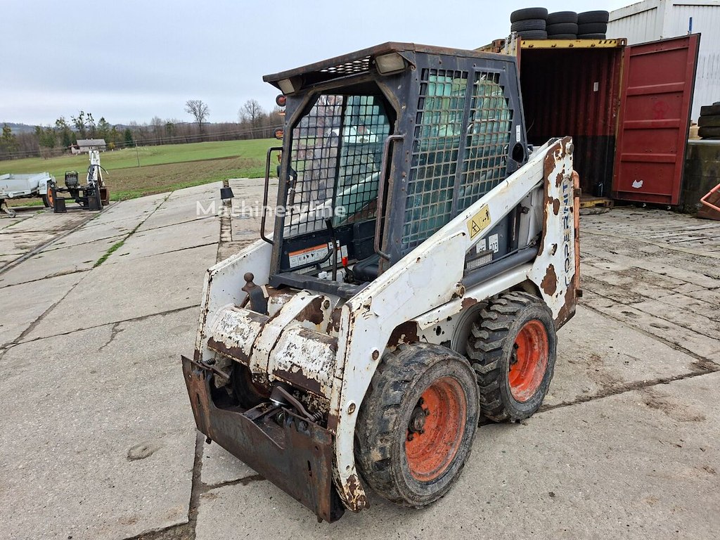 Prodaje se Bobcat 553 4X4 + MELROE INGERSOLL-RAND 725S B/H mini utovarivač na aukciji