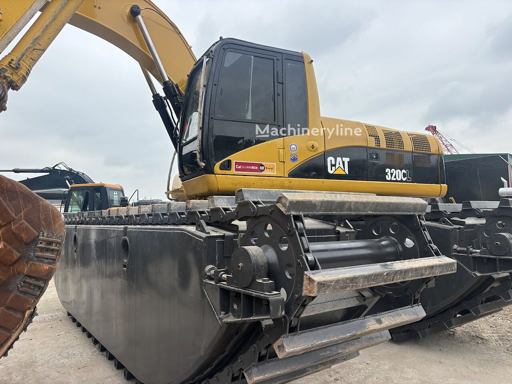 Caterpillar 320CL bager amfibija
