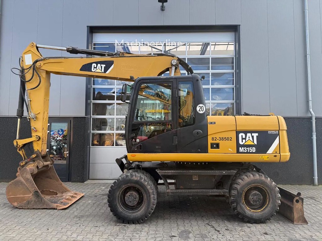 Caterpillar M315D bager točkaš