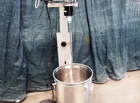 unknown Motorized propeller agitator with small container.