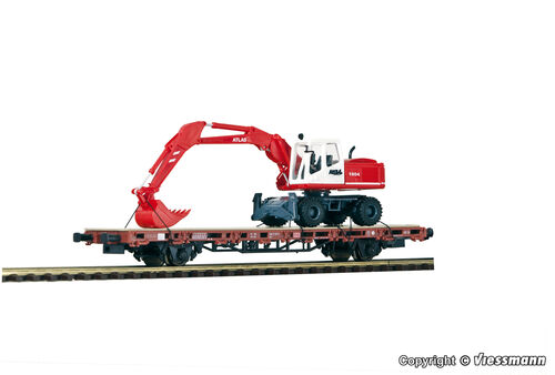 NEW! Kibri 26258 Model w gablotce - Wagon platforma z koparką Atlas 1604