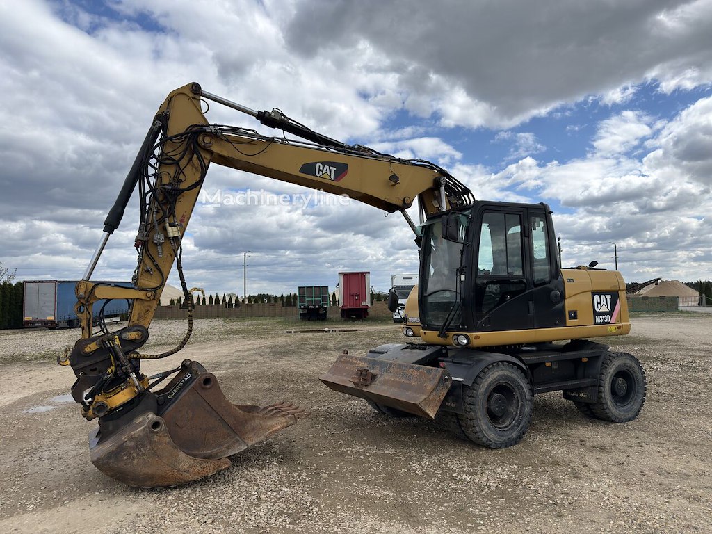 Caterpillar M313D bager točkaš