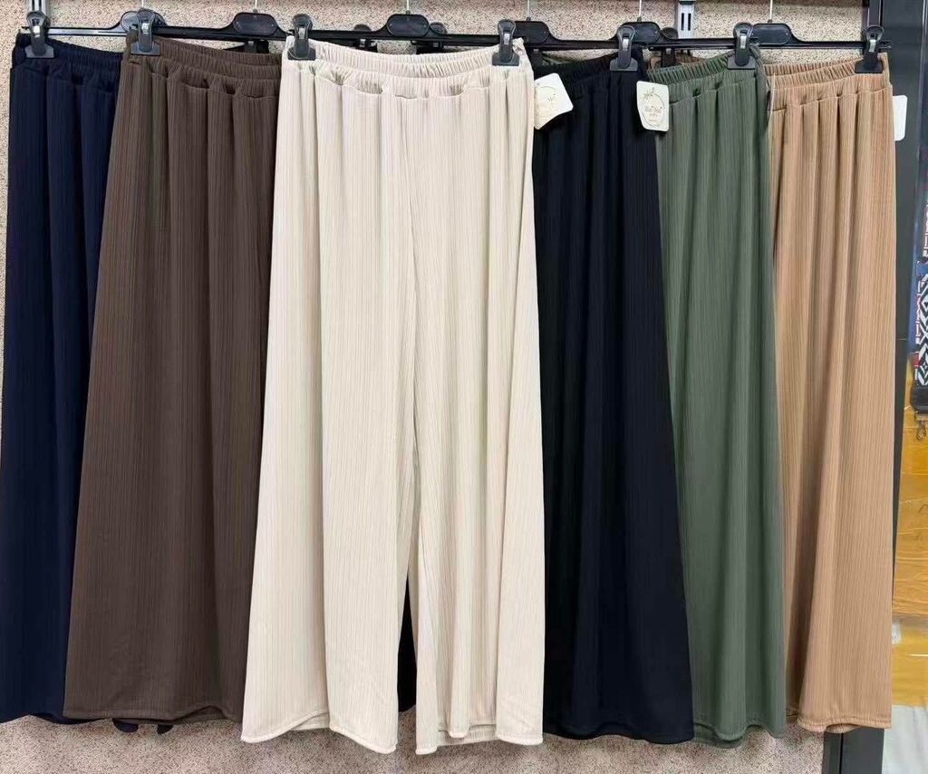 Ženske široke plisirane pantalone sa lastišem u struku - Kroj: široke