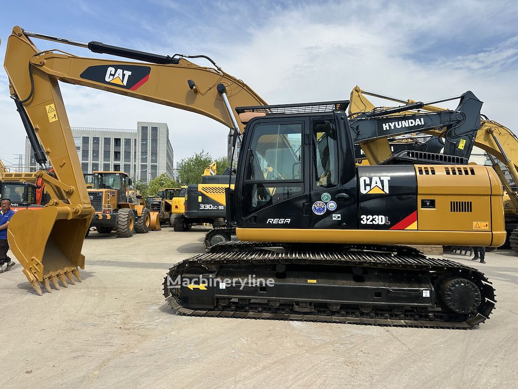 Caterpillar 323DL bager guseničar
