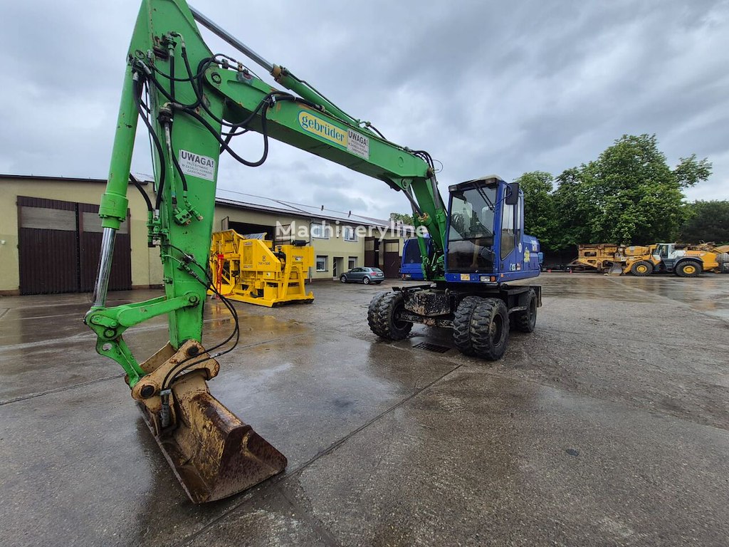 Caterpillar 315 bager točkaš