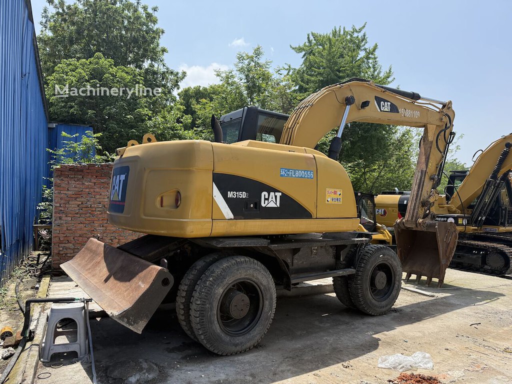 Caterpillar M315 bager točkaš