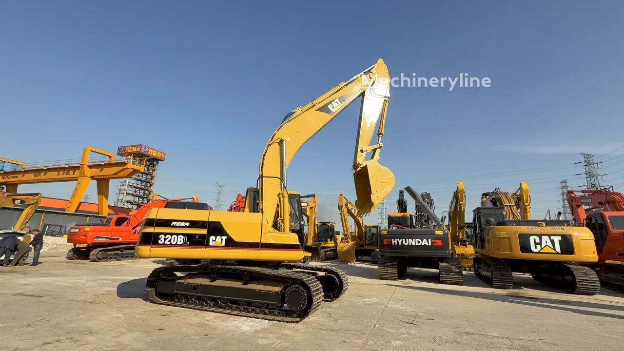 Caterpillar 320BL bager guseničar