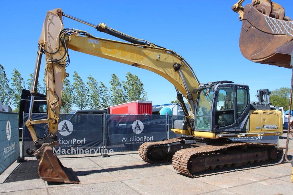 Prodaje se New Holland Kobelco E 265C bager guseničar na aukciji