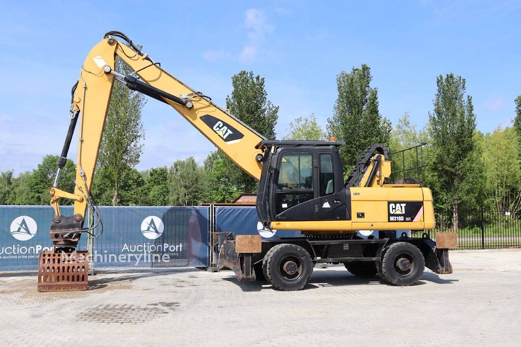 Prodaje se Caterpillar M318D bager za pretovar na aukciji