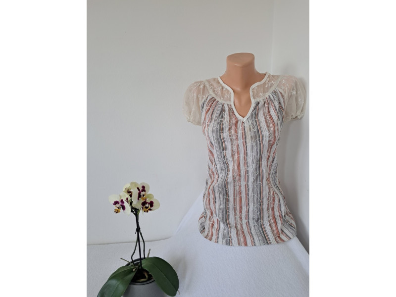 P...S... elegantna bluza sa vezom vel 34