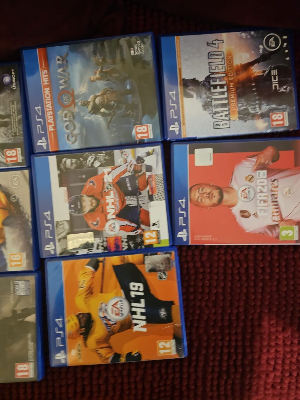 PS4 kolekcija originalnih igara – naslovi u kutijama sa omotima i